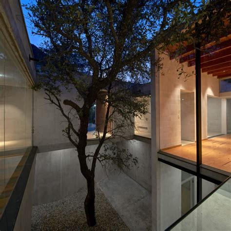 Concrete Latticework And Two Courtyards Filter Light Into Mexican House By Delfino Lozano