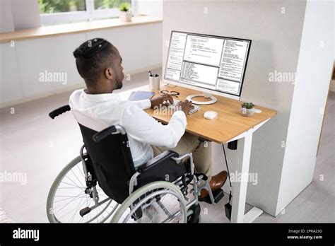 African American Coder Using Computer At Desk Stock Photo Alamy