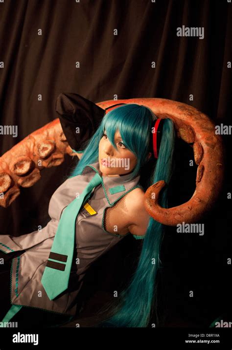 Cosplay Anime Performer Poses Onstage With A Big Fake Octopus Tentacle At A Dr Sketchy