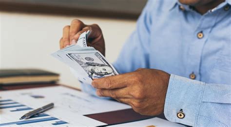 Premium Photo Man Counting Banknotes
