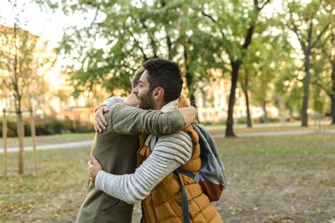 Two People Hugging Each Other