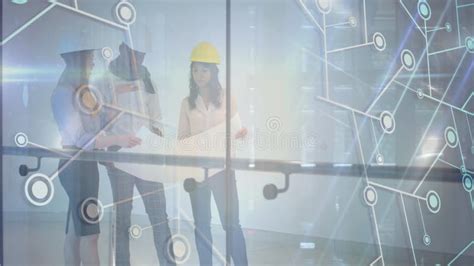 Reviewing Blueprints With Digital Network Animation Engineers Collaborate In Office Stock