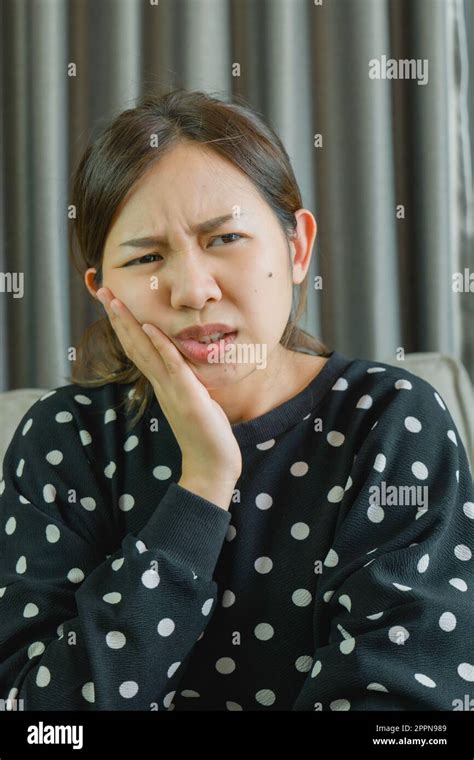 Closeup Young Woman Touching Her Face And Suffering From Toothache