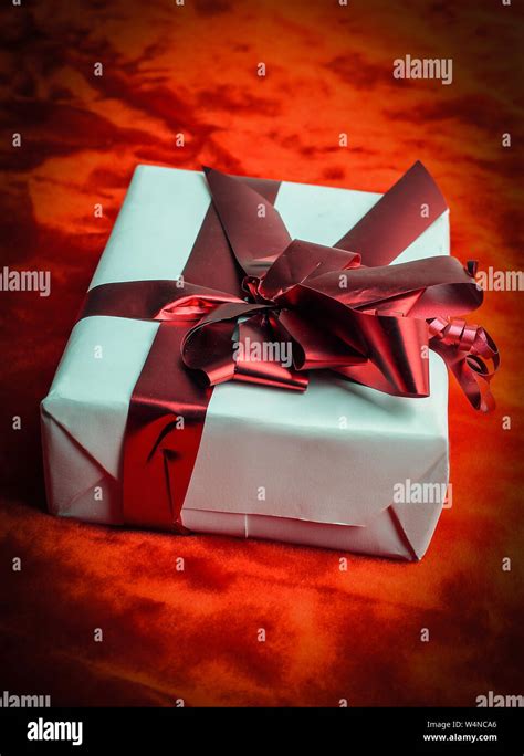 Closeupboxes With Ts With Ribbon Isolated On Red Background Stock