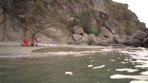 Two Young Girls Playing On The Beach At Sarti Greece Stock Video