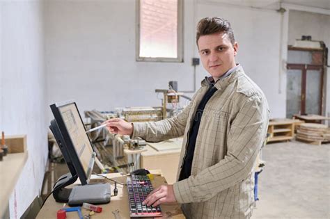 Operator Entering Coordinates On Computer For Cnc Machine To Precisely Cut Wooden Pieces Stock