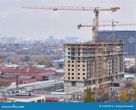 Monolithic Frame Construction Of The Building Workers Working At The Construction Site At Home