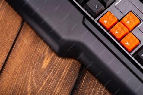 Premium Photo Orange Arrow Keys On A Black Keyboard Up Down Left Right Buttons On A Gaming