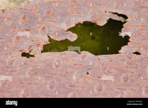 Rusty Metal Plate With Corrosion Holes On Old Corroded Diamant Plate Shows Grunge Steel And