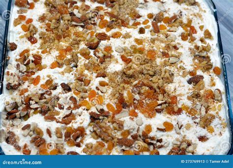 Konafa Topped With Whipped Cream Raisins Nuts Shredded Coconut And Stuffed With Cream And