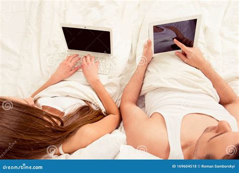 Top View Of Man And Woman Working With Laptop And Tablet In Bed Stock Photo Image Of Lovers