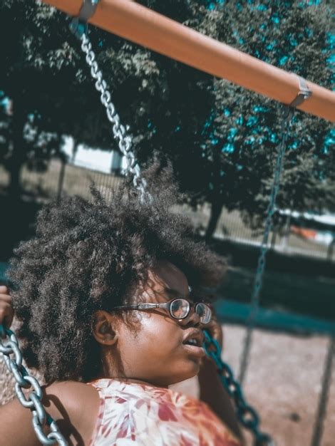 Premium Photo Close Up Of Girl Swinging At Park