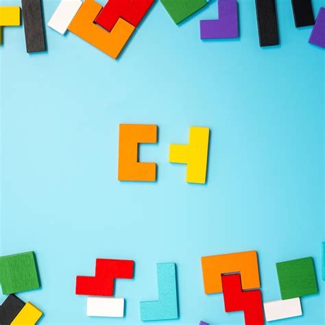 Premium Photo Colorful Wood Puzzle Pieces On Blue Background Geometric Shape Block Concepts