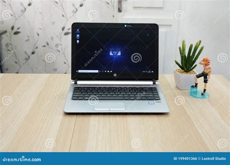 Black Hp Laptop On A Wooden Table Office Equipment Editorial Photo Image Of Industry Games