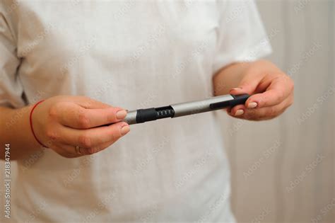 Diabetes Patient Turn Knob On End Of Insulin Pen And Dial Up Correct