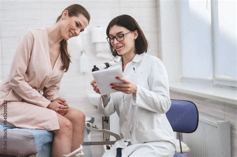 Woman Doctor Look Microscope At Gynecologists Appointment Female