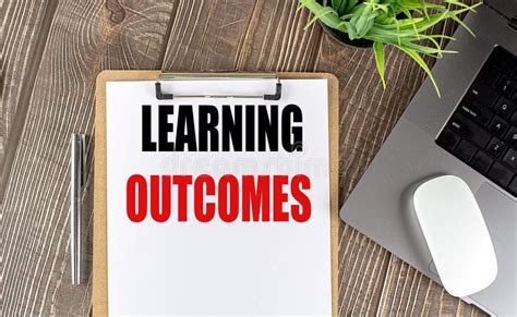 Learning Outcomes Text On Clipboard Paper With Laptop Mouse And Pen Stock Image Image Of