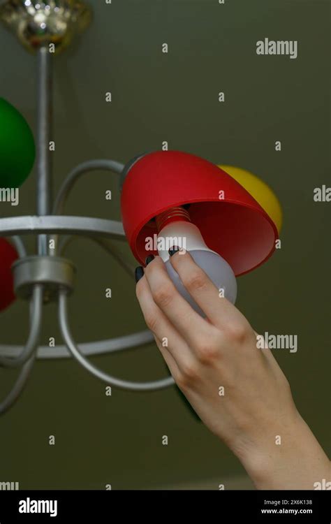 Replacing The LED Light Bulb In The Lamp Stock Photo Alamy