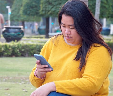 Portrait Fat Asian Woman Long Black Hair Wearing Yellow Shirt Are Using