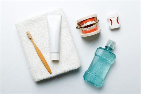 Premium Photo Mouthwash And Other Oral Hygiene Products On Colored Table Top View With Copy