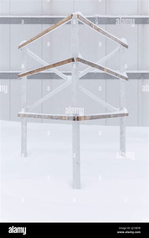 an empty framework in the snow outside a building in longueuil quebec