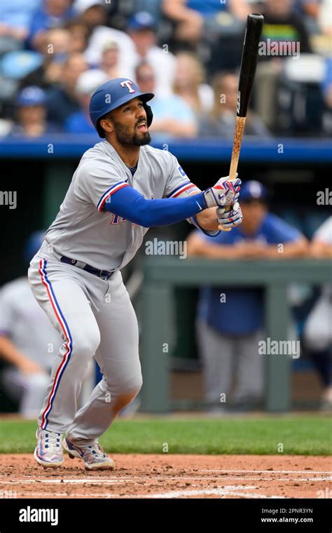 Texas Rangers Marcus Semien Hits A Single During The Second Inning Of A Baseball Game Against