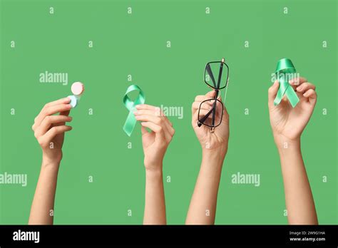 Female Hands With Ribbons Eyeglasses And Container For Contact Lenses