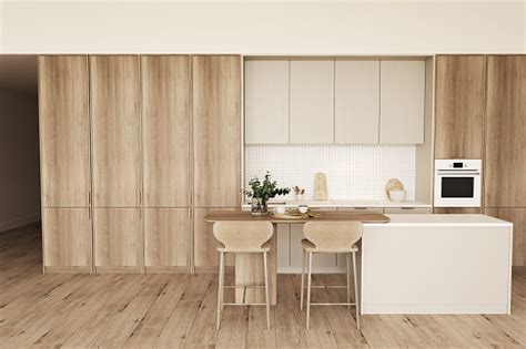 베이지 톤의 주방 인테리어에는 아일랜드와 바 스툴이 있습니다 정면도 주방 용품이있는 호텔 식사 공간 밝은 나무 바닥 3d 렌더링 고품질 3d 그림 부엌에 대한 스톡 사진 및