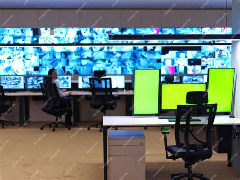 Premium Photo Interior Of Big Modern Security System Control Room With Blank Green Screens