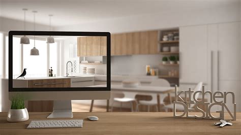 건축가 디자이너 프로젝트 개념 집 키 3d 문자 단어 부엌 디자인 및 데스크탑 초안을 보여주는 나무 테이블 흐리게 배경 화이트 인테리어 디자인에서 공간 가정 주방에 대한