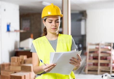 Female Civil Engineer Making Notes While Controlling Construction Site Stock Image Image Of