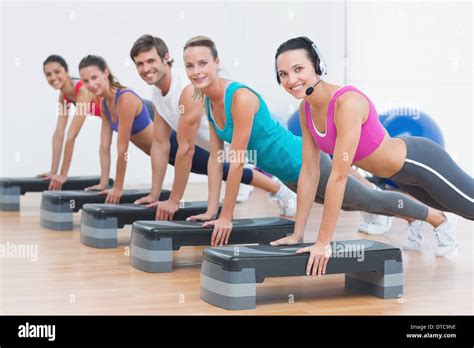 Fitness Class Doing Step Aerobics Exercise Stock Photo Alamy
