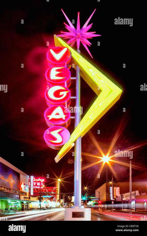 Neon Vegas Sign At Night On Freemont Street A City Street In The