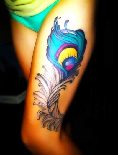 Peacock Feather On Thigh Tattoo Idea