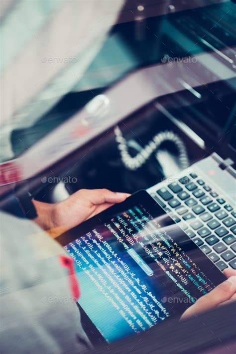 hacker using computer smartphone and coding to steal password and private data remotely from