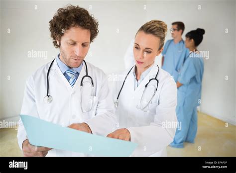 Doctors Reading File Stock Photo Alamy
