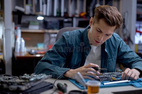 Professional Technician Or Engineer Installing Cpu Microprocessor To Motherboard Socket Stock