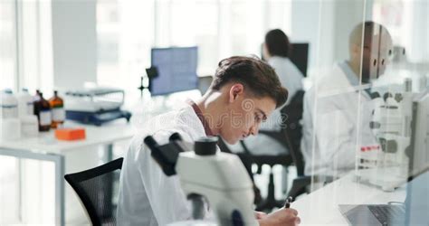 Science Laboratory And Research With Man Notes And Microscope Data Analysis For Report