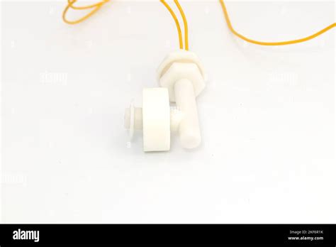 Front View Of A Water Level Or Liquid Level Sensor With Float Switch And Yellow Wire This