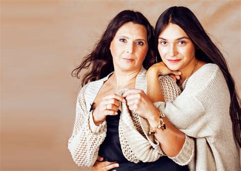 Cute Pretty Teen Daughter With Mature Mother Hugging Fashion St Stock