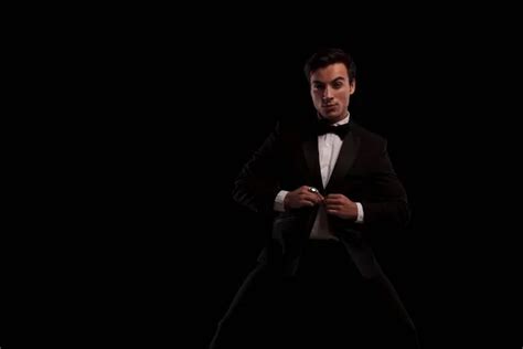 Sexy Man In Tuxedo Fixing His Collar Stock Photo By Feedough