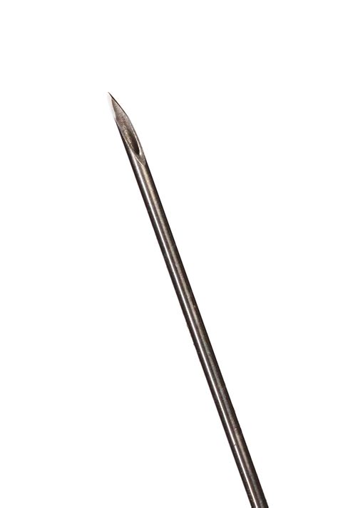Premium Photo A Vertical Shot Of Hypodermic Needle Isolated On White