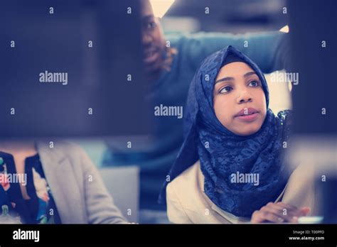 Black Muslim Female Software Developer Working Together With Her Multiethnics Business Team