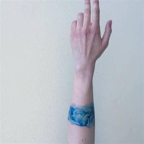 Abstract Blue Watercolor Armband Tattoo On The Left Forearm Arm Band