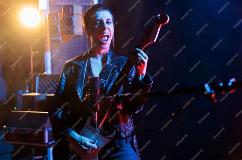 Premium Photo Superstar Woman Standing In Front On Microphone While