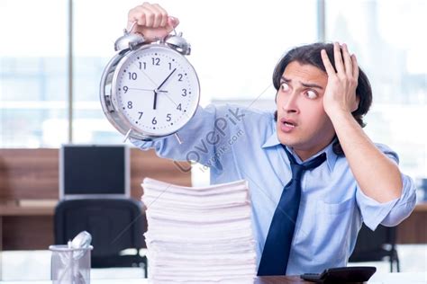 Unsatisfied Young Employee Dealing With Overwhelming Workload Picture And Hd Photos Free