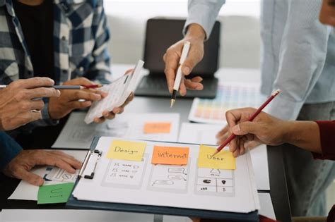 Premium Photo Ui Designer Brainstorming About Mobile App Interface