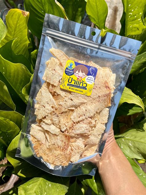 หมึกบดชิ้นเล็ก 70 กรัม เนื้อนุ่ม ปรุงรสหวานเค็มเล็กน้อย ไม่เผ็ด ป้าแก้วหมึกแดดเดียวปากน้ำปราณ