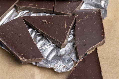 A Broken Chocolate Bar In A Paper And Foil Package Stock Image Image Of Cocoa Black 283097209