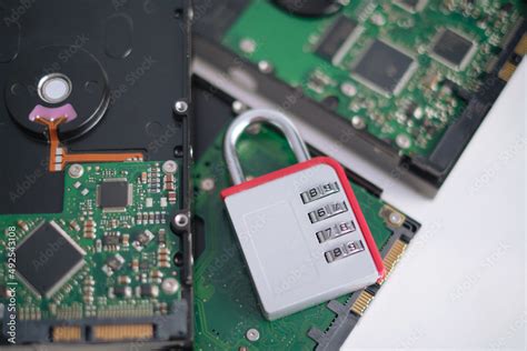 Encrypted Hard Disk Padlock With Cipher On An Opened Hard Disk Data Loss Computer Motherboard